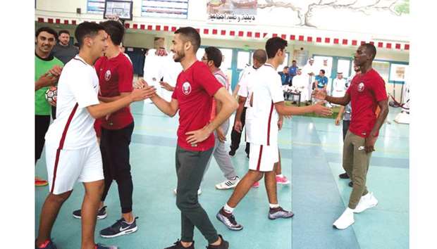 Qatar football players take part in school sports event - Gulf Times