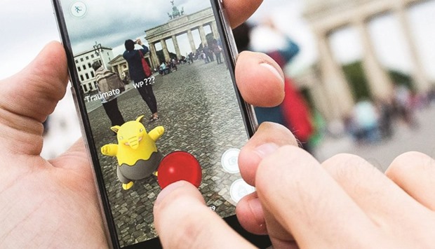 Poking Pokemon - Gulf Times