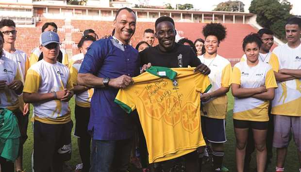 Qatar 2022 worker reunites with Cafu to deliver Generation Amazing ...
