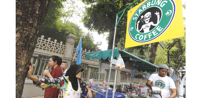 ‘Starbung’ coffee vendor defies multinational in Bangkok - Gulf Times